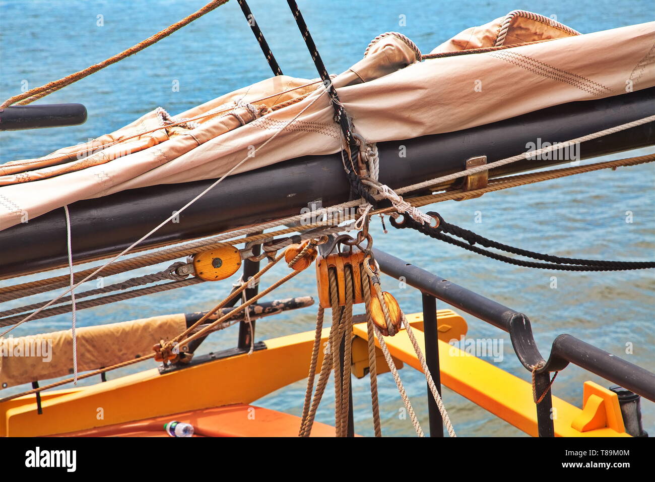 Furled Sail on Mast Stock Photo - Alamy