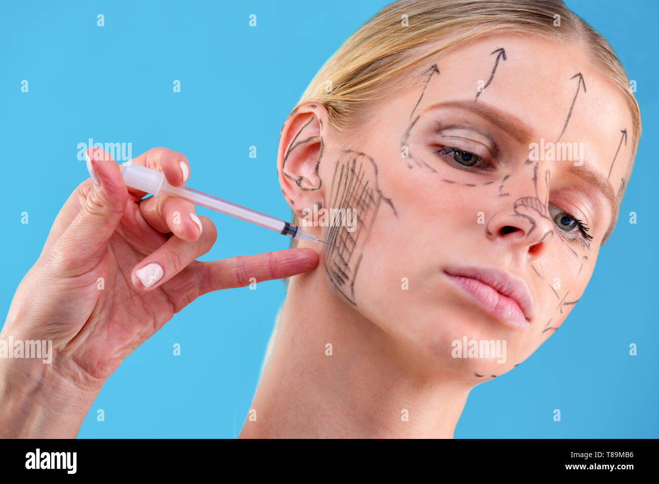face of a girl with smooth skin without wrinkles makes beauty shots ...