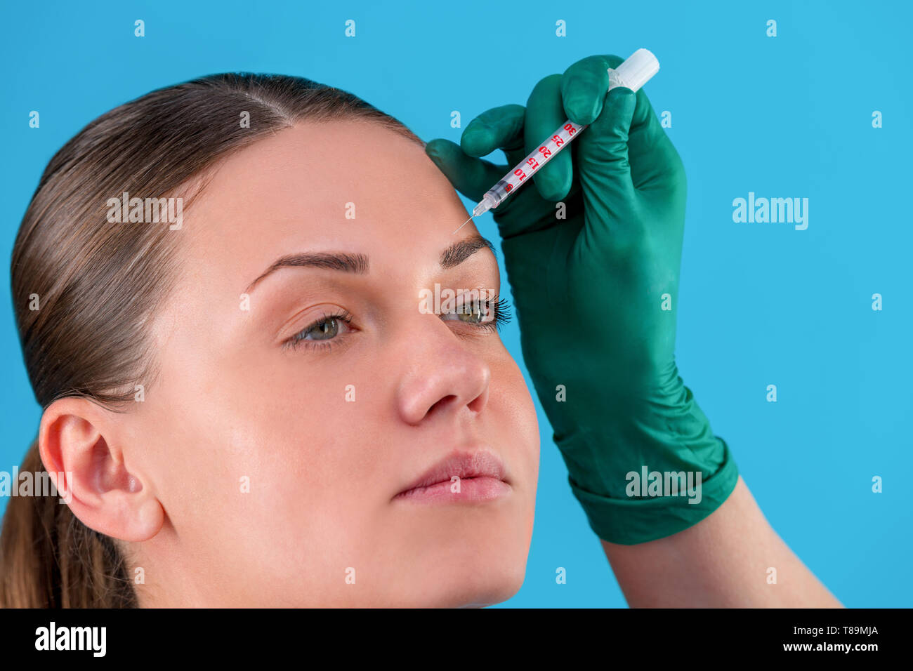 face of a girl with smooth skin without wrinkles makes beauty shots ...