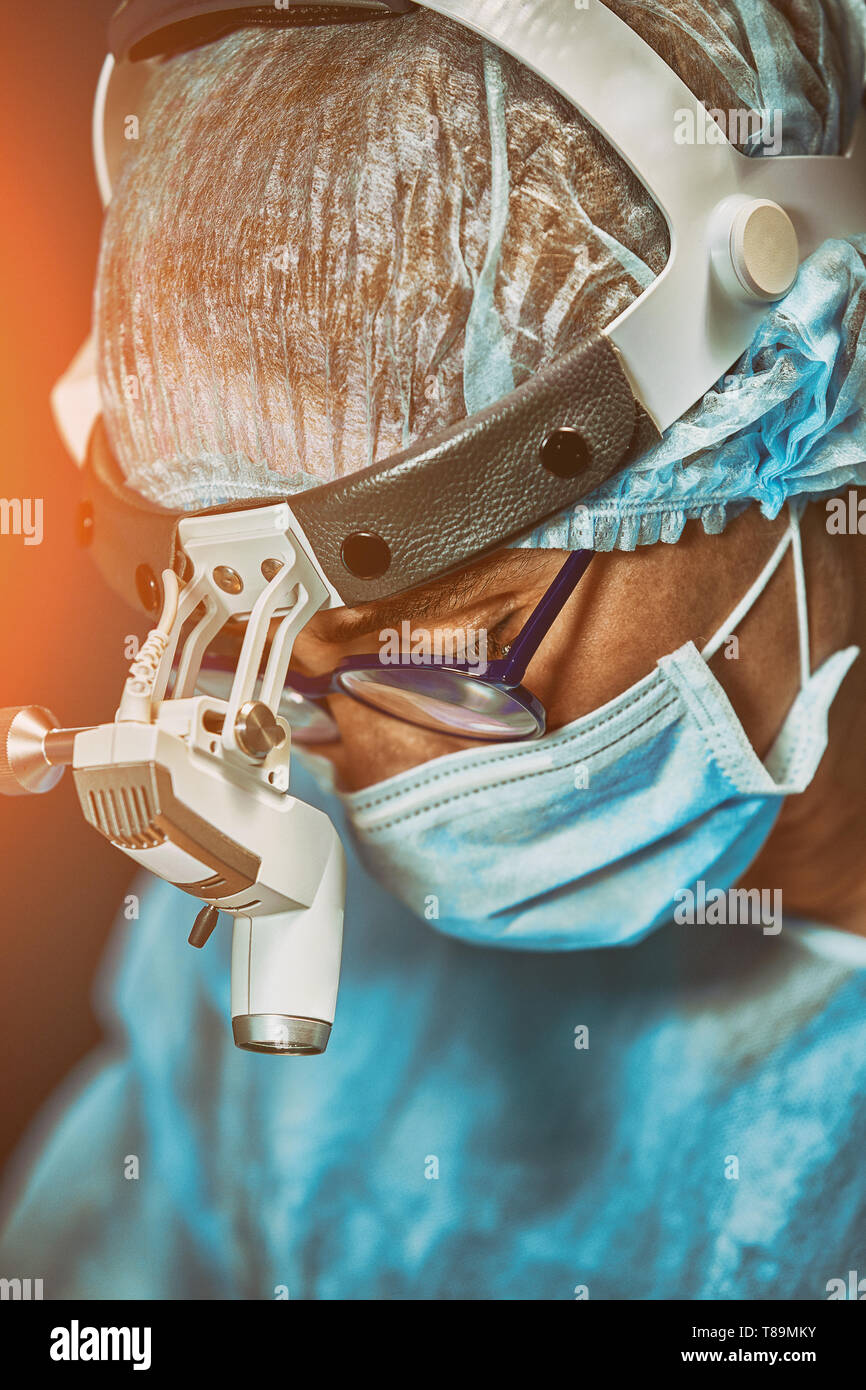 Female surgeon in operation room with reflection in glasses Stock Photo ...