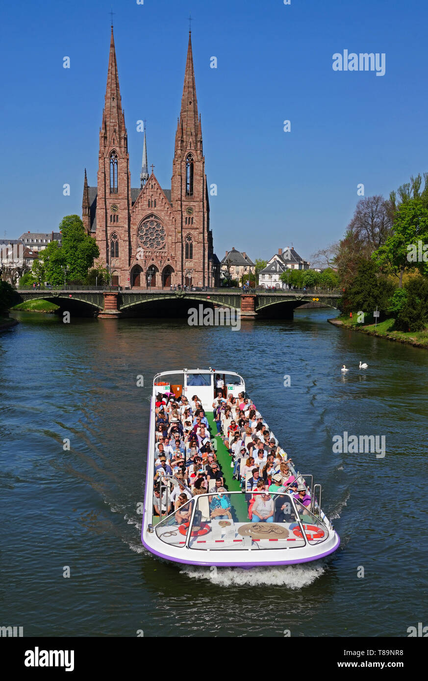 Sightseeing tour boat on canal in Strasbourg, France, with Saint-Paul's ...