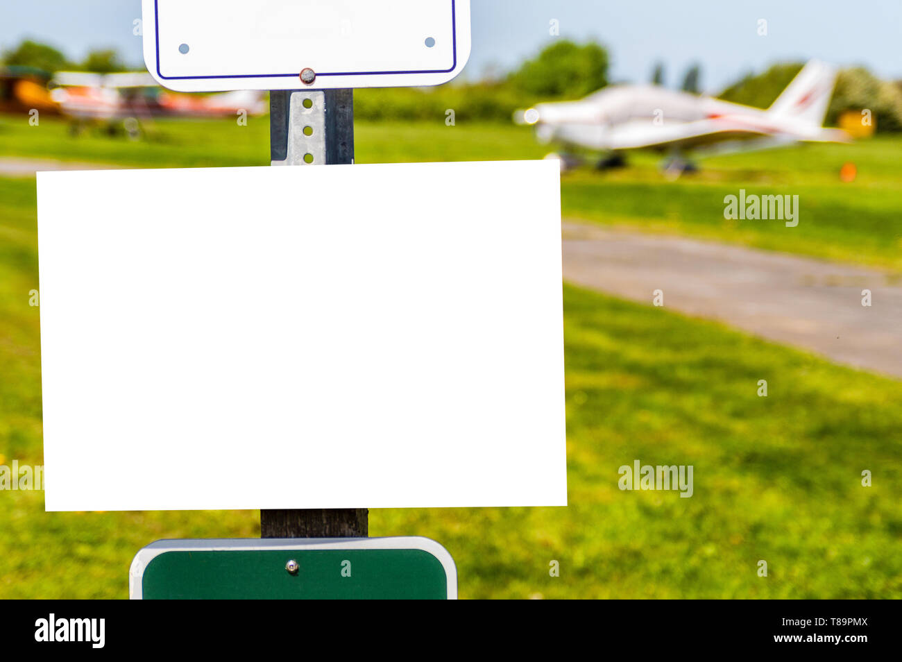 Blank white sign for copy hung on post at small plane airstrip Stock ...