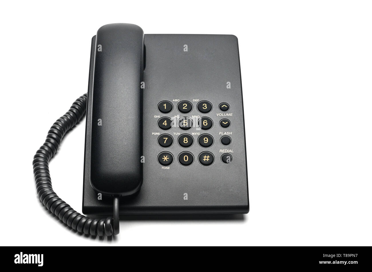 Classic wired telephone used at home and in offices on a white isolated ...