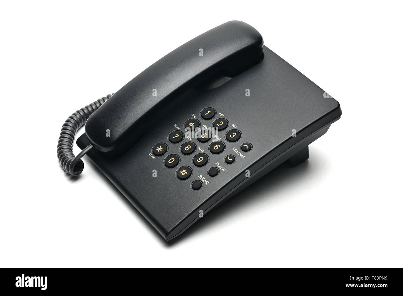 Classic wired telephone used at home and in offices on a white isolated ...