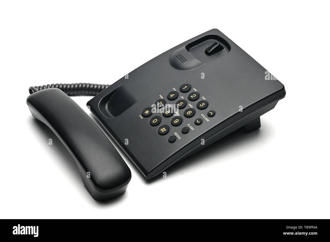 Classic wired telephone used at home and in offices on a white isolated ...