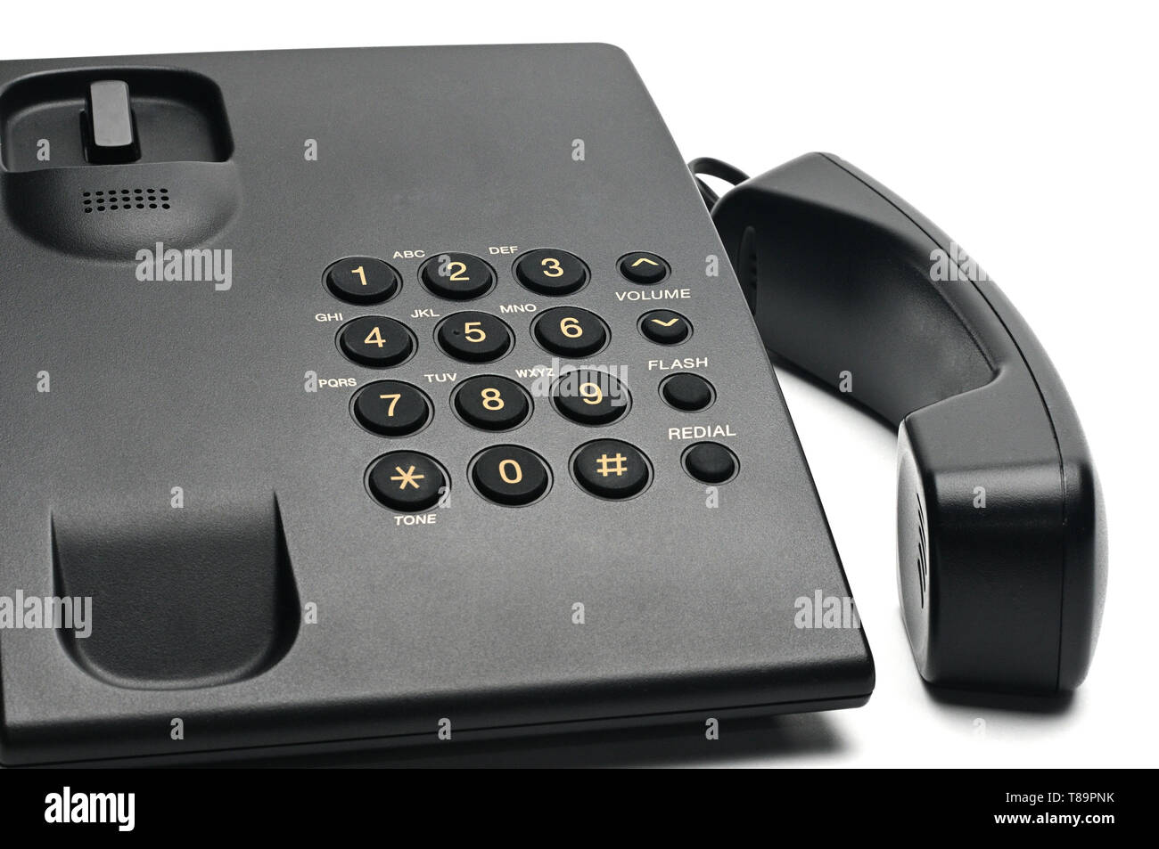 Classic wired telephone used at home and in offices on a white isolated ...