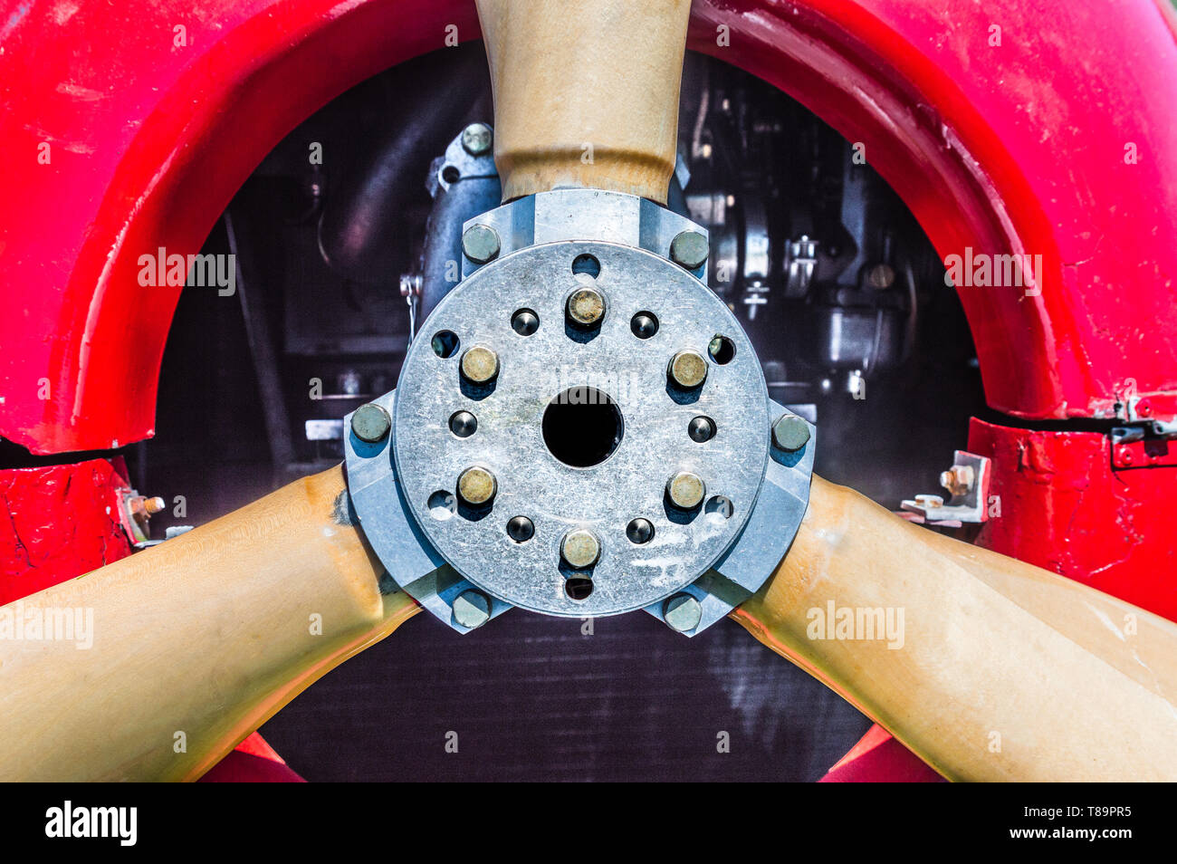 Close front view detail of vintage red biplane propeller, engine ...