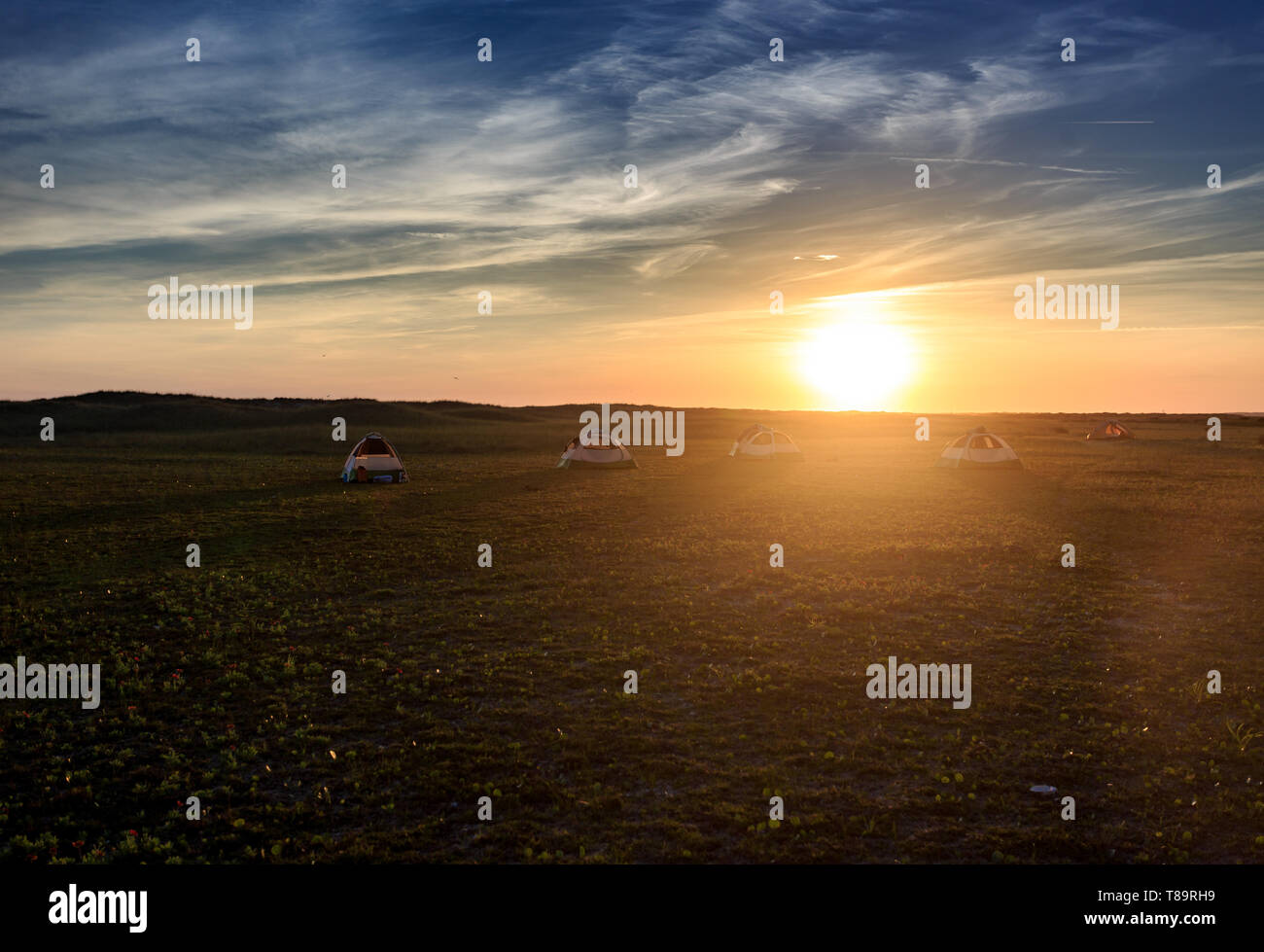 Group of tents at sunset Stock Photo - Alamy