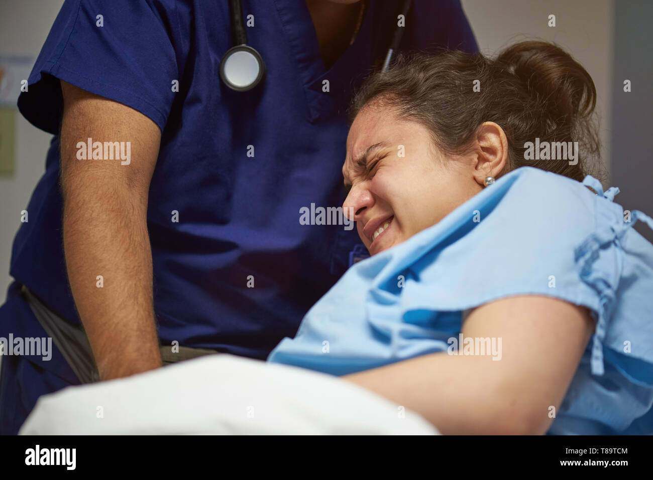 Doctor helping woman in pain. Medical help support theme Stock Photo ...