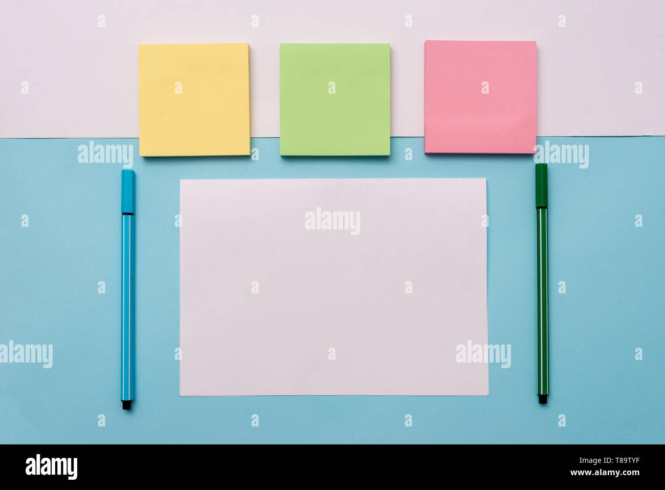 Note papers and stationary placed sideways on top of softhued backdrop ...