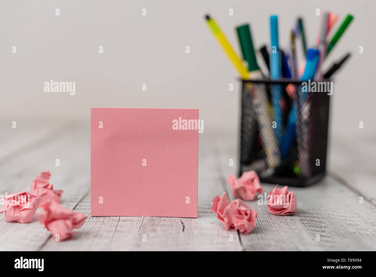 Set of plain note paper with scraps and stationary on the wooden table ...