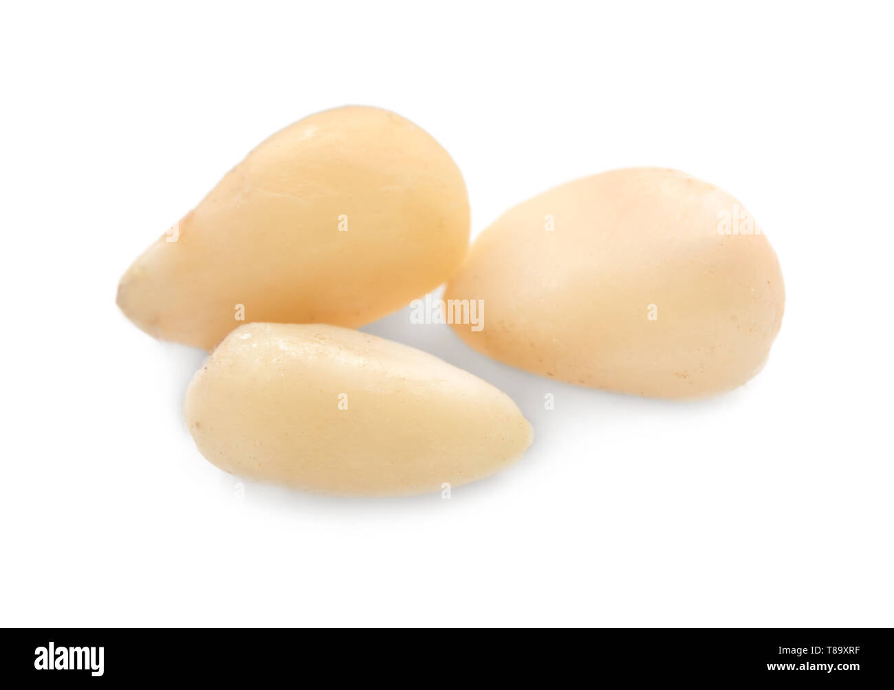 Tasty pine nuts in white background Stock Photo - Alamy