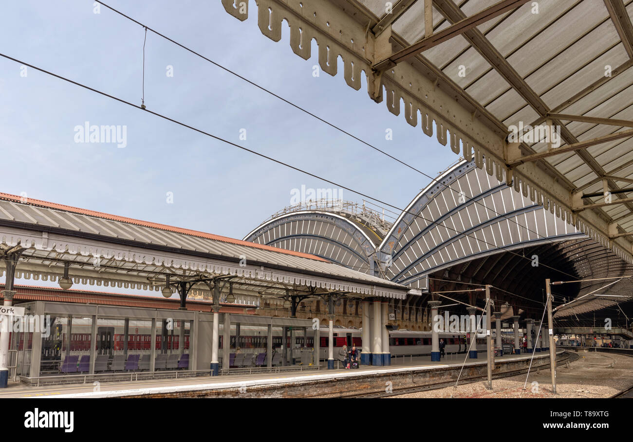 Typical view of a railway station platform with a train waiting to ...