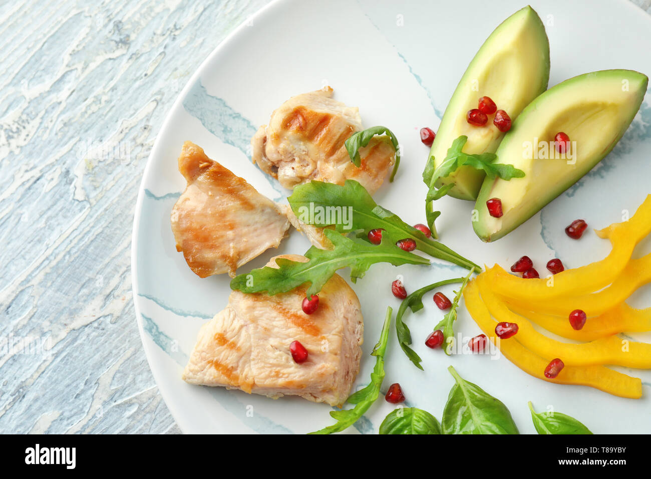 Plate with tasty avocado salad on table, closeup Stock Photo - Alamy