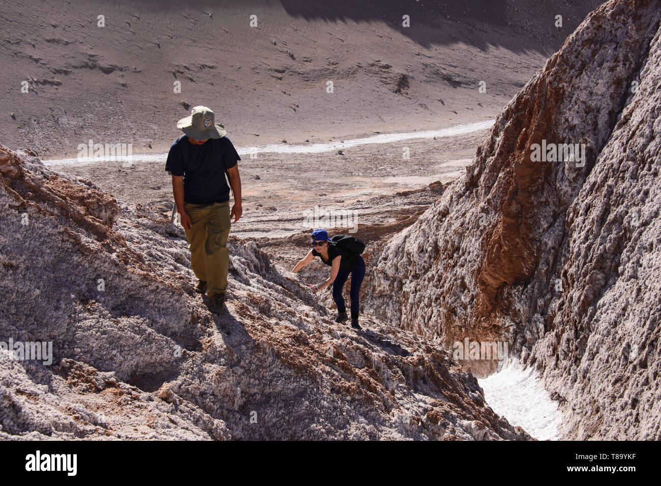 Tourist enjoying the salt, sand, and desertscape in the Moon Valley ...