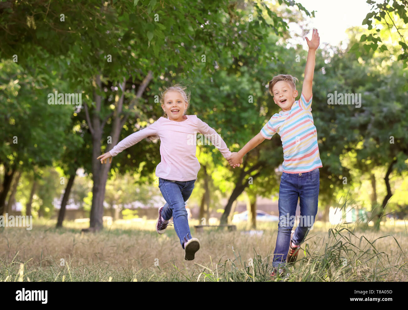 Cute little children having fun outdoors Stock Photo - Alamy