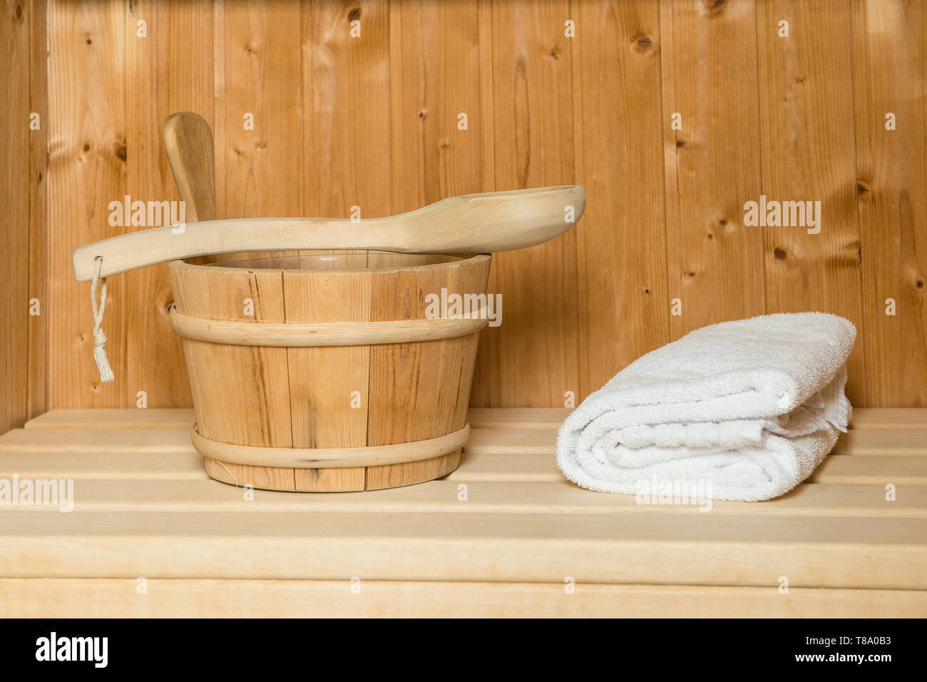 Sauna cabin ready for usage with wooden bucket with wooden spoon and ...