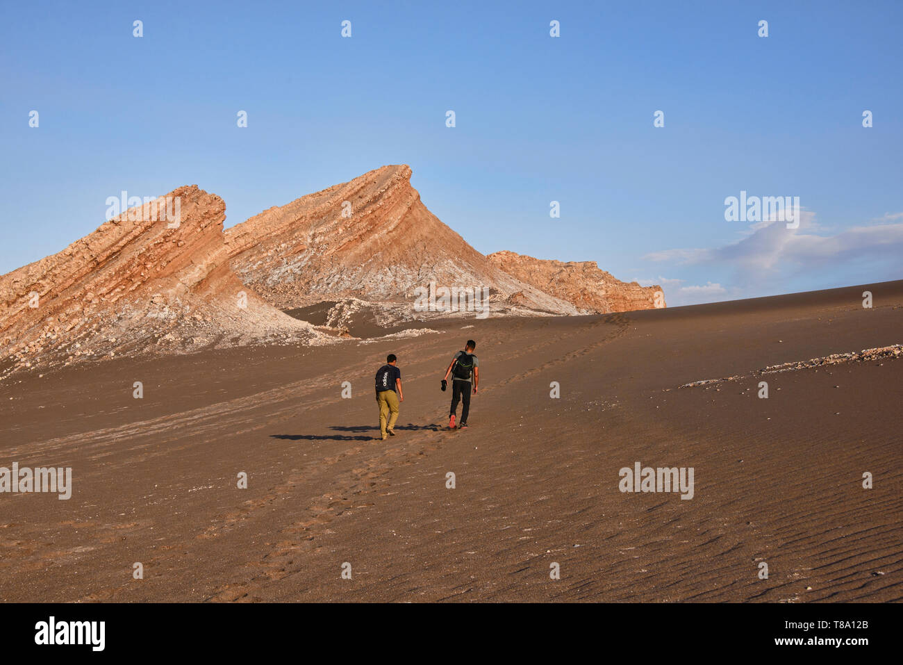 Tourist enjoying the salt, sand, and desertscape in the Moon Valley ...