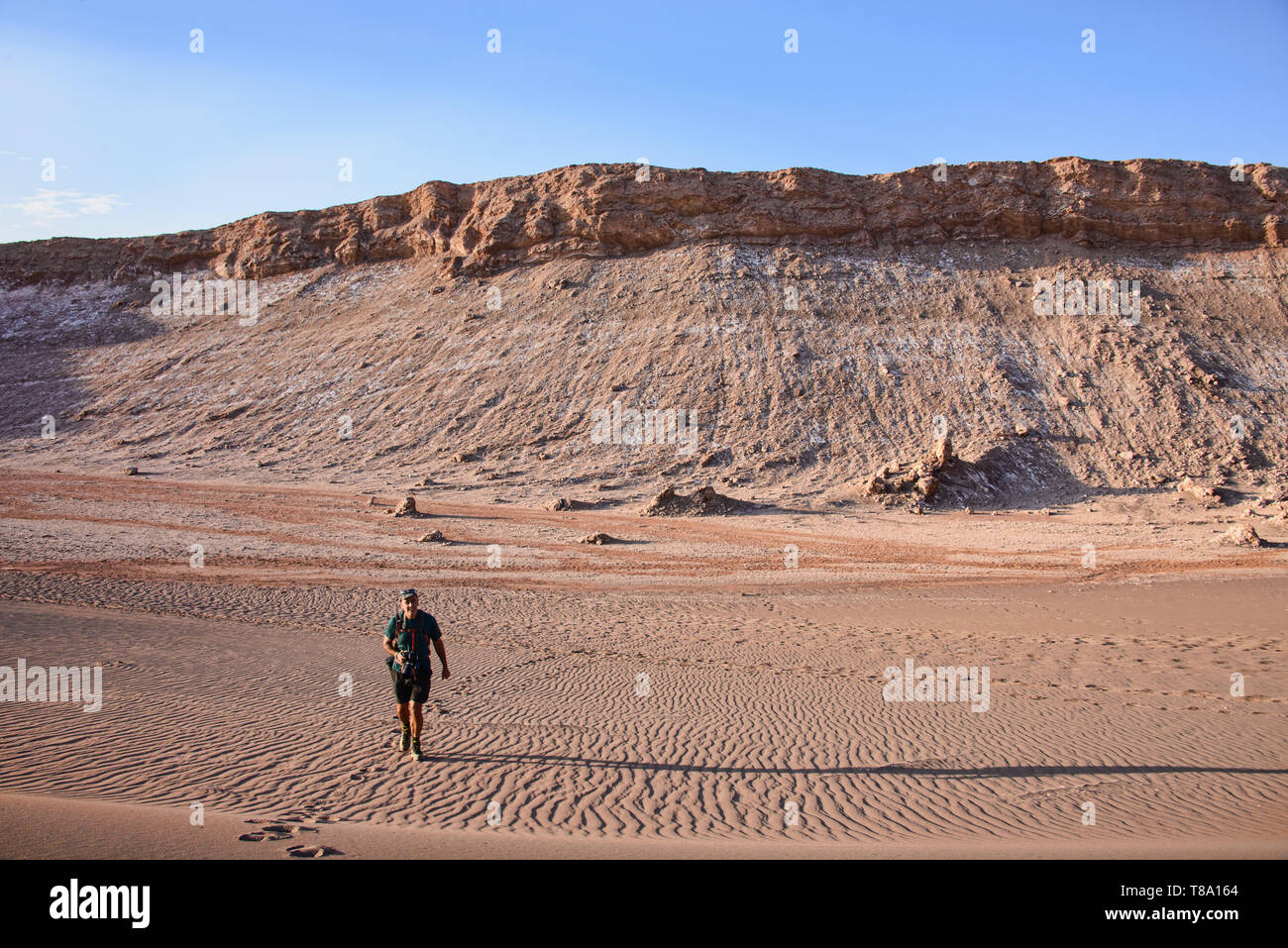 Tourist enjoying the salt, sand, and desertscape in the Moon Valley ...