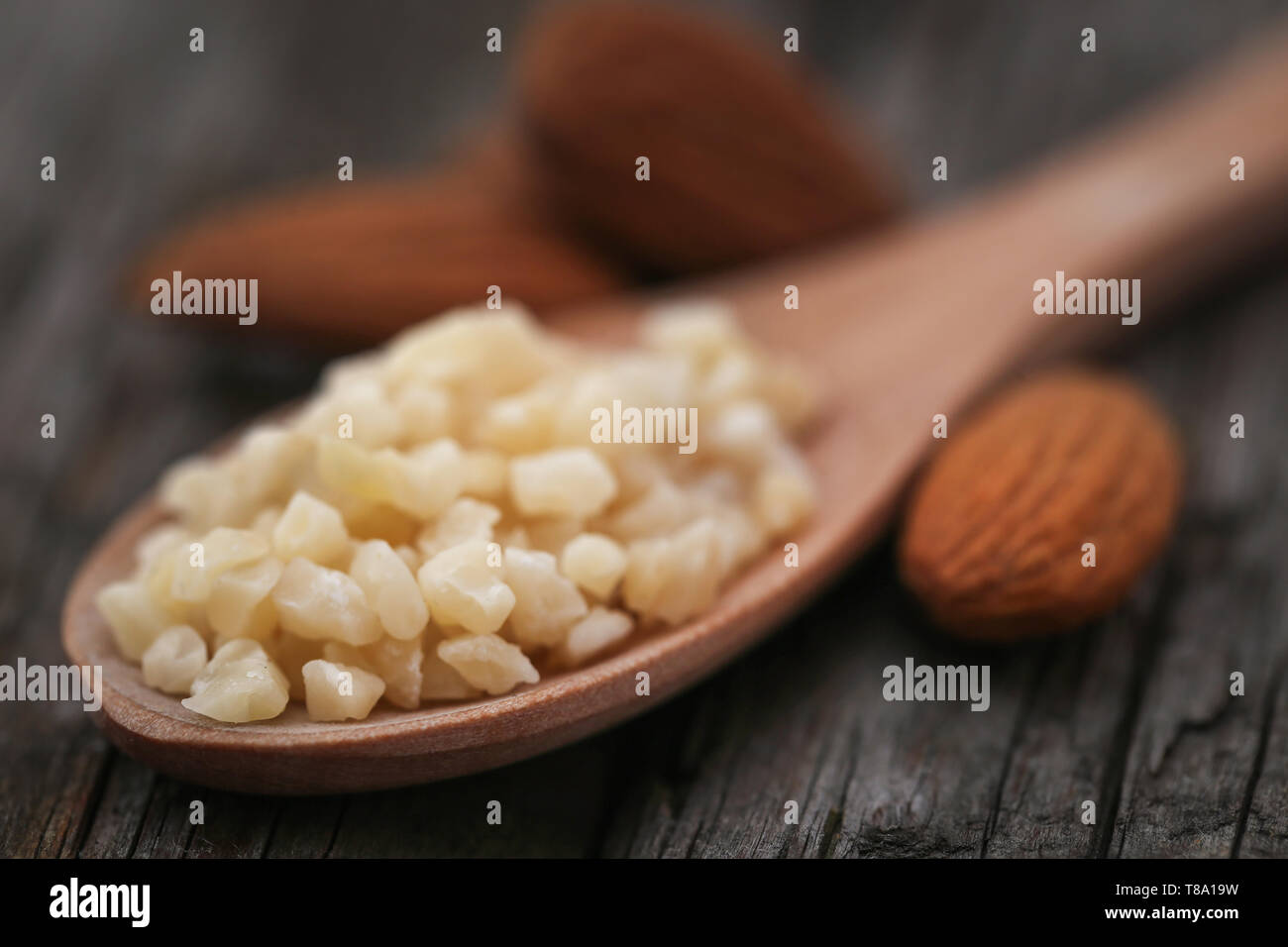Small pieces of chopped almonds with whole ones Stock Photo - Alamy