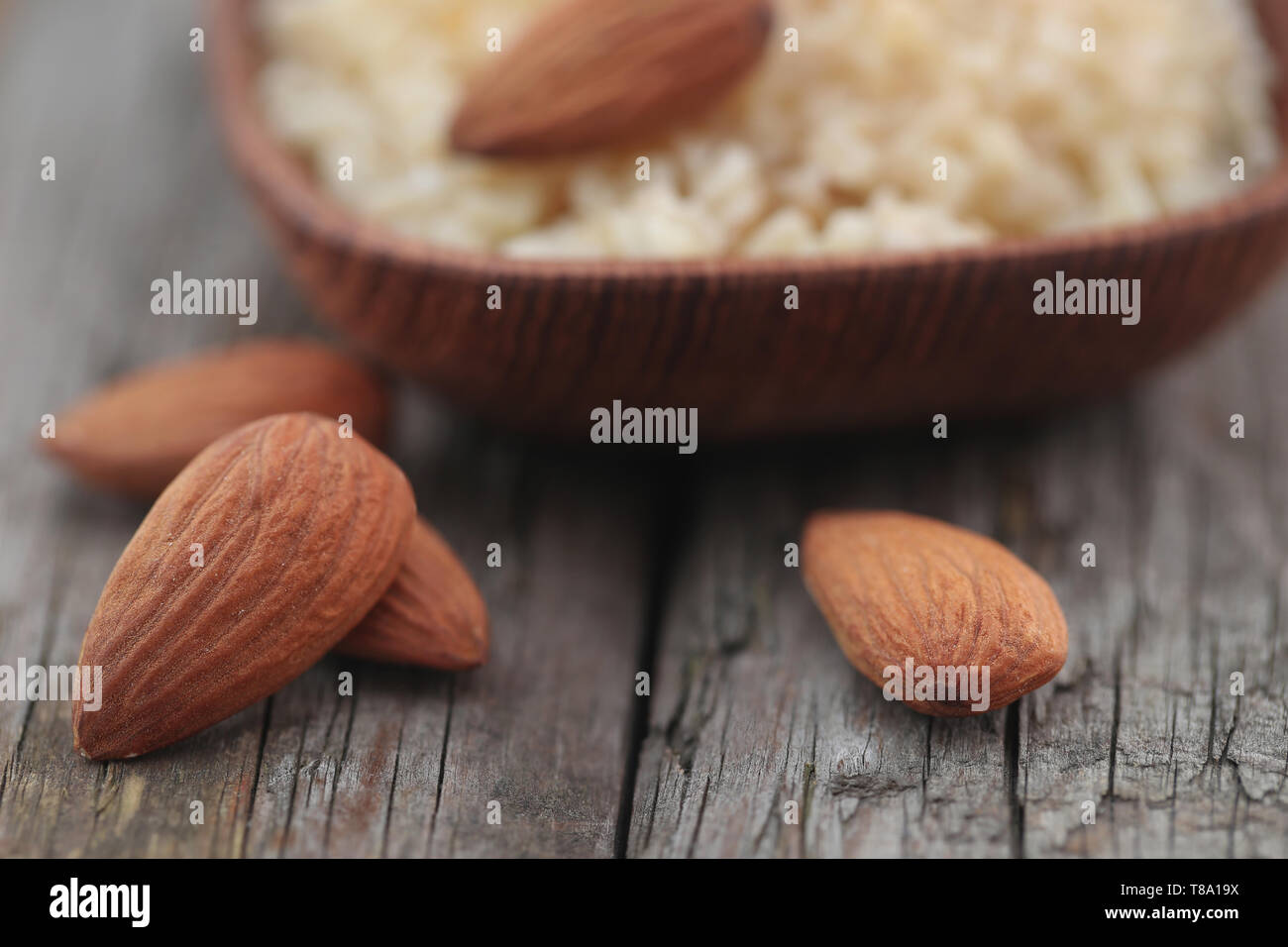Small pieces of chopped almonds with whole ones Stock Photo - Alamy