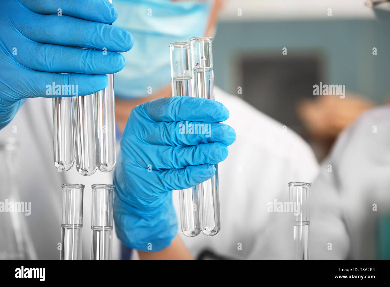 Scientists holding test tubes with samples in laboratory Stock Photo ...