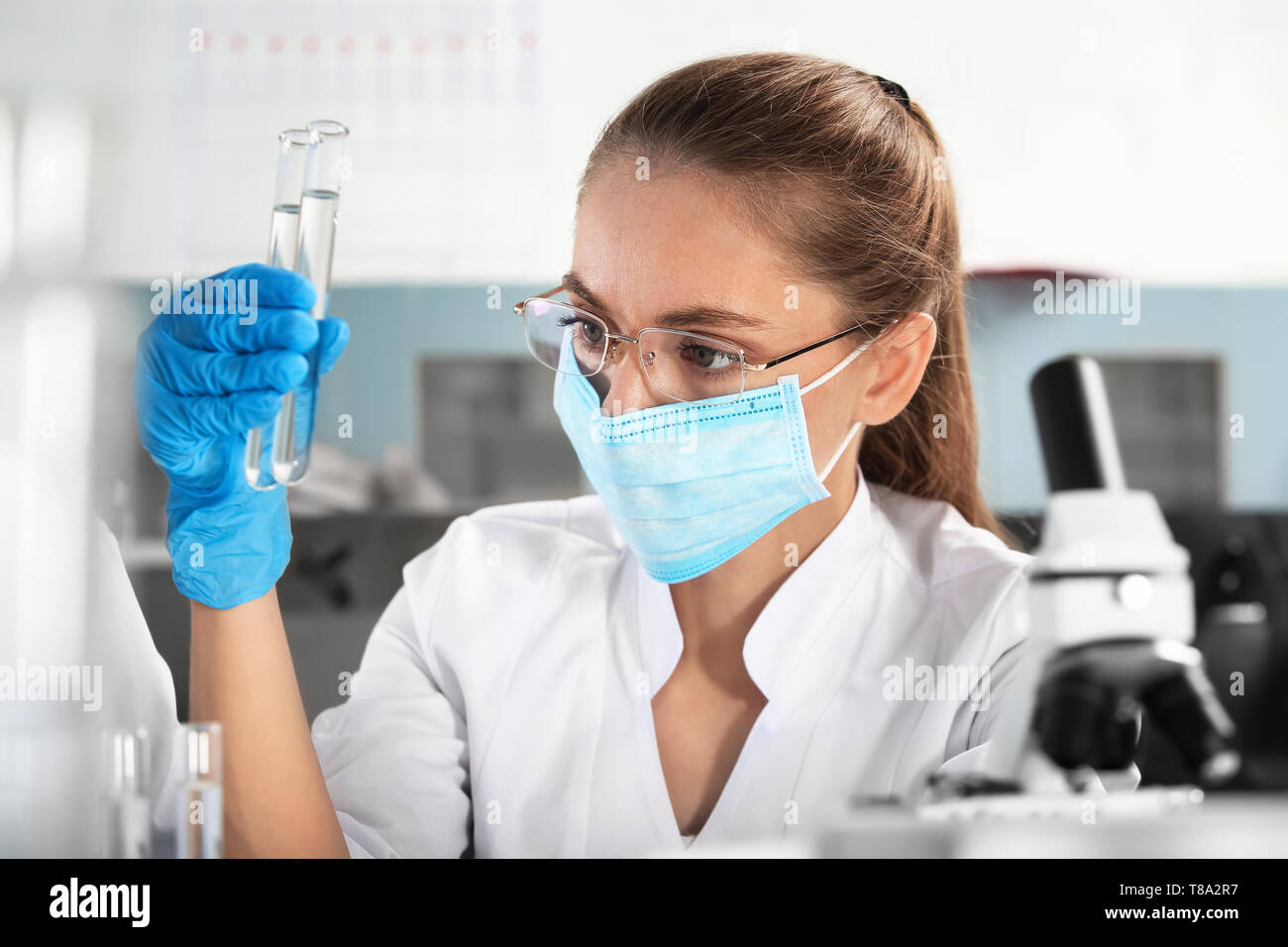 Scientist holding test tubes hi-res stock photography and images - Alamy