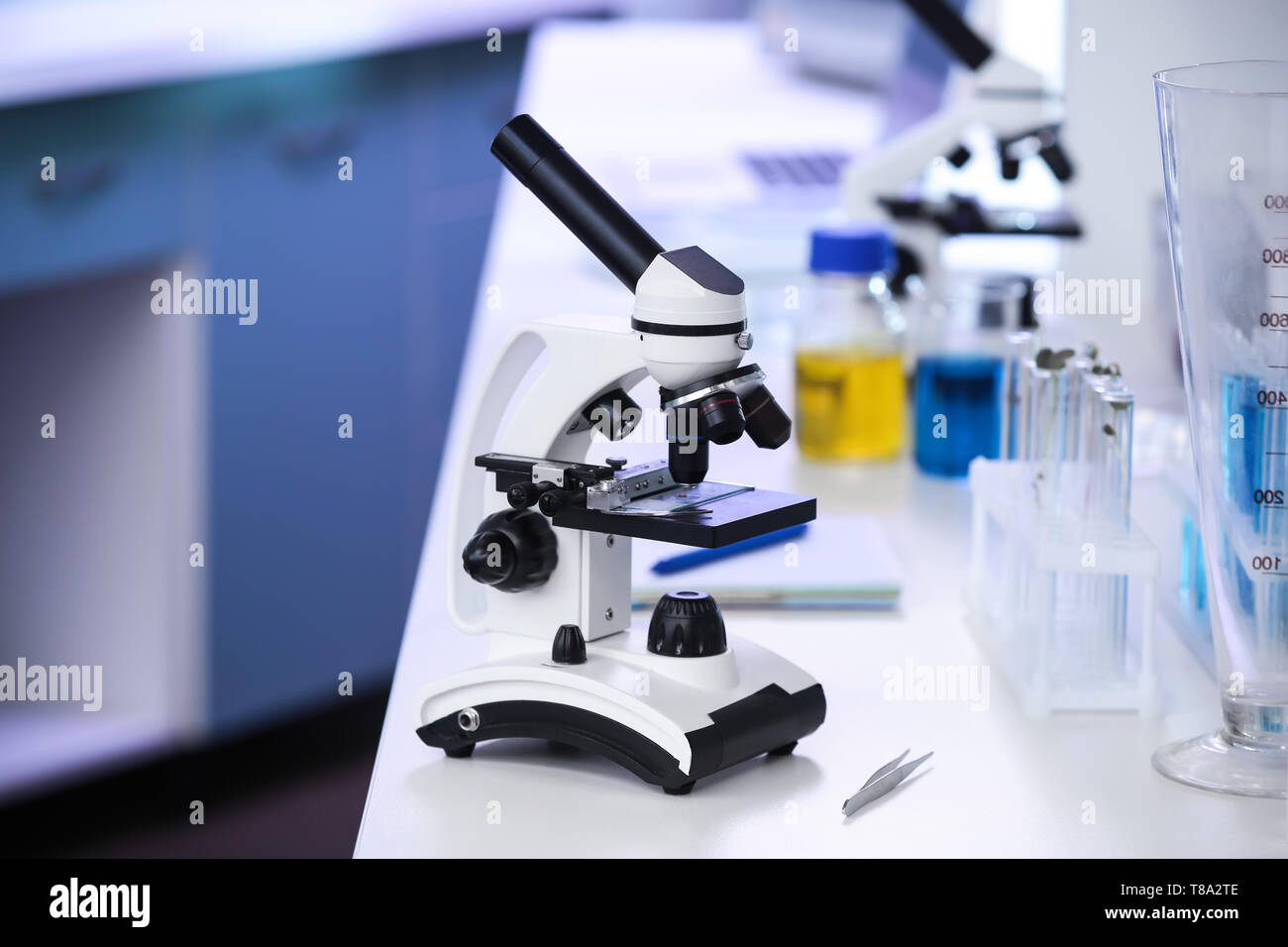 Modern microscope on table in laboratory Stock Photo - Alamy