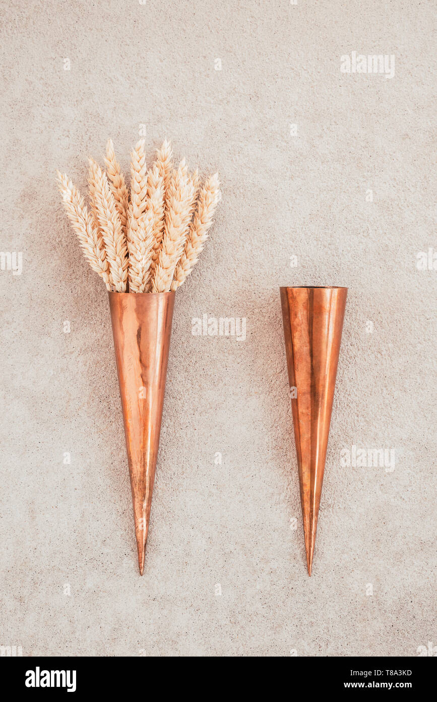 Vintage copper cones and wheat ears on concrete surface Stock Photo - Alamy