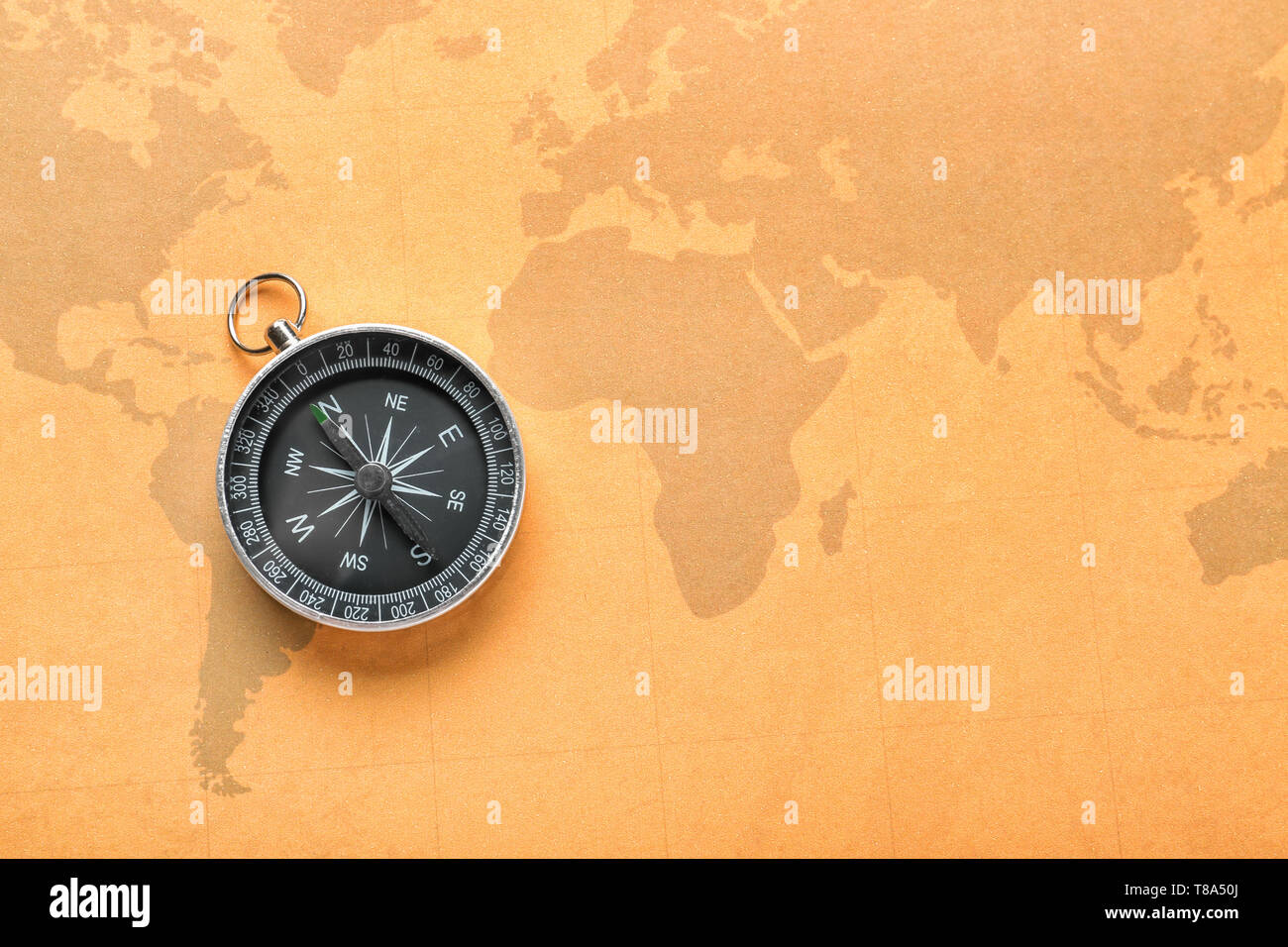 Modern compass on vintage world map. Travel planning concept Stock ...