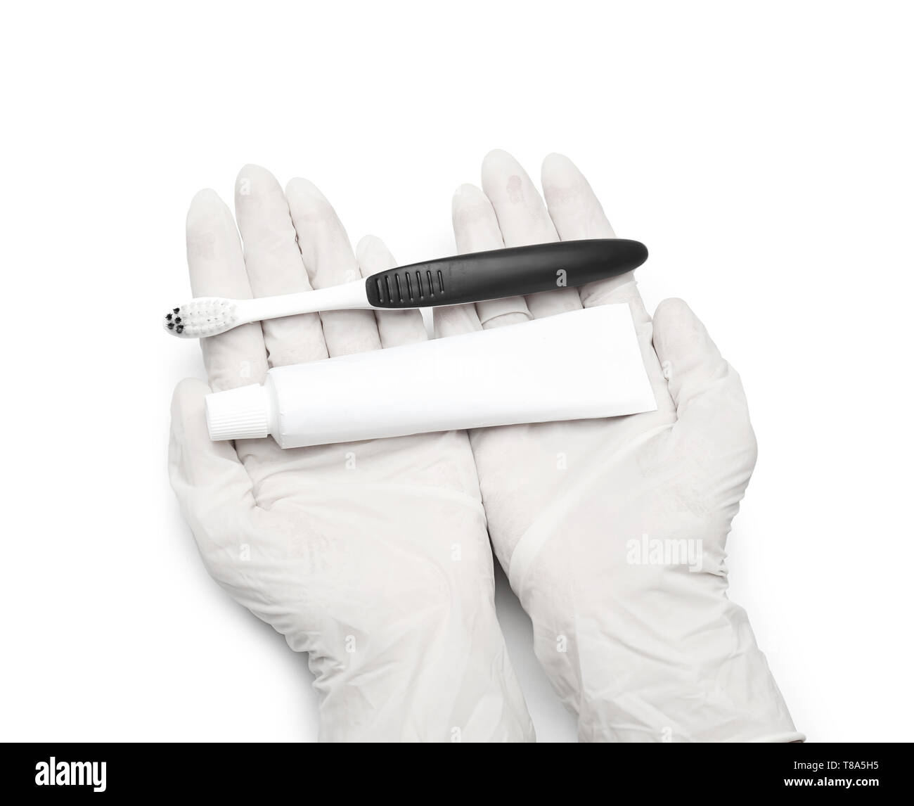 Dentist with toothpaste and brush on white background Stock Photo - Alamy