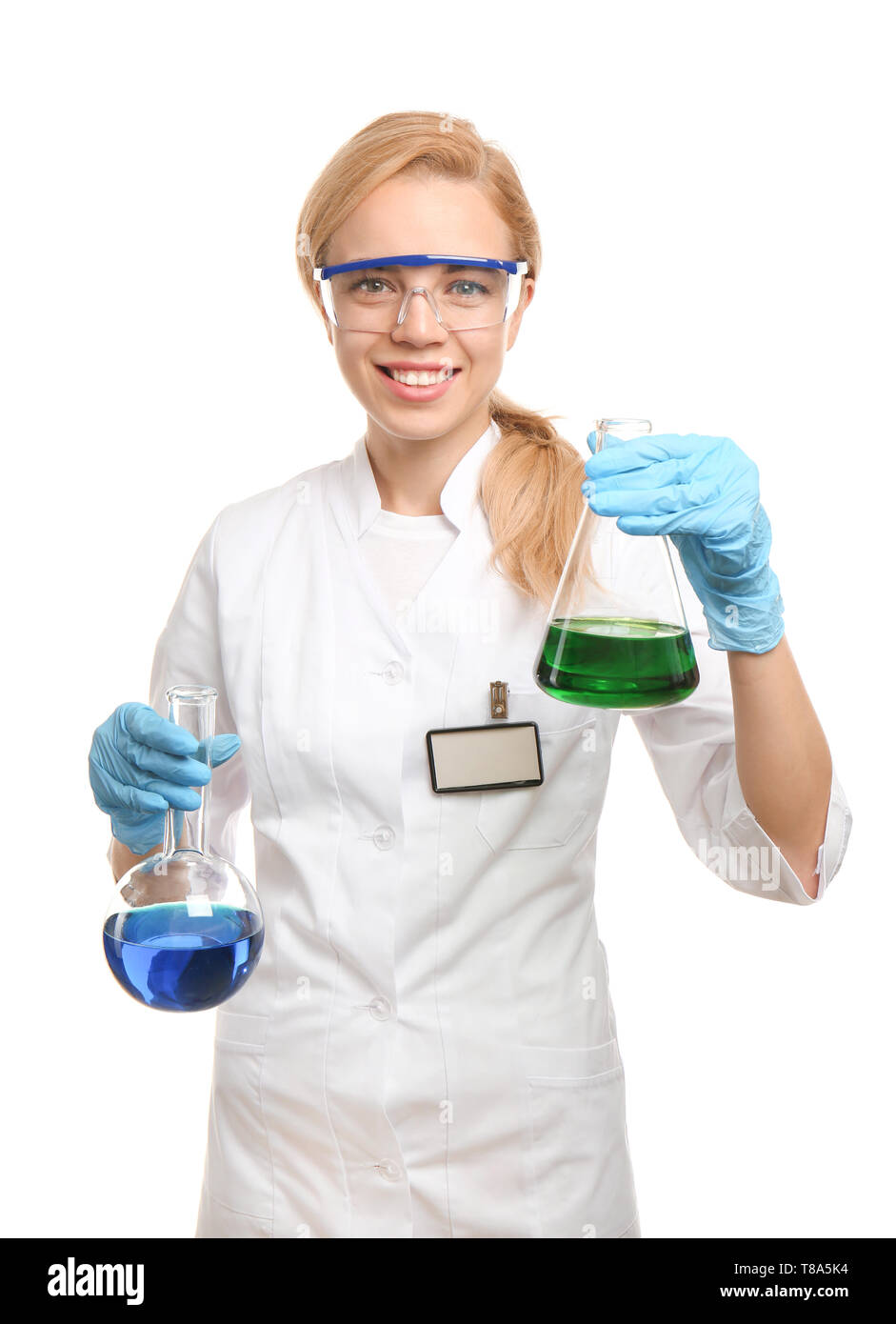 Female scientist with flasks on white background Stock Photo - Alamy