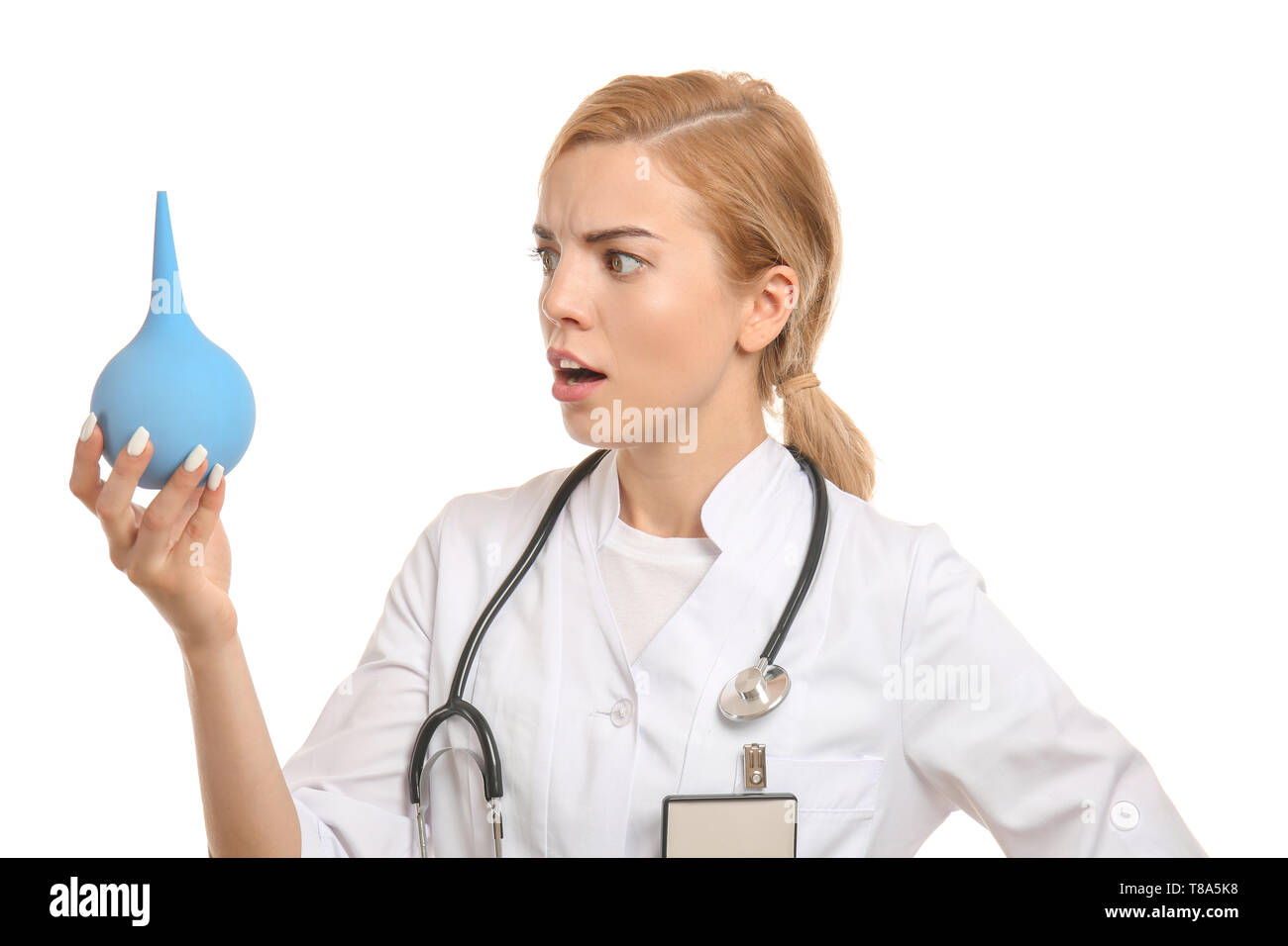 Emotional female doctor holding medical pear on white background Stock ...