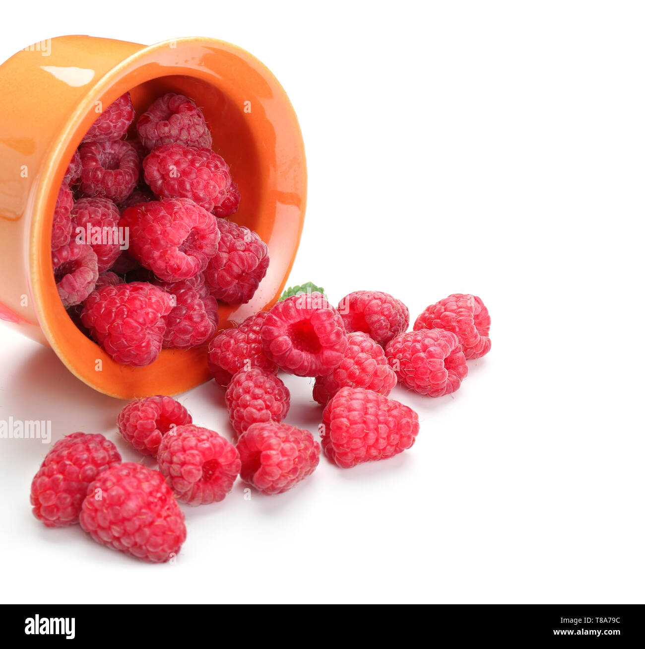 Overturned bowl with ripe raspberries on white background Stock Photo ...