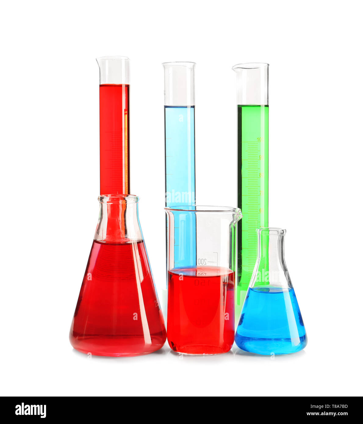 Laboratory glassware with colorful liquids on white background Stock ...