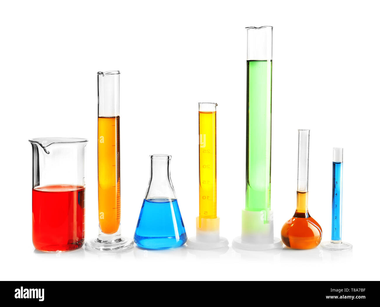 Laboratory glassware with colorful liquids on white background Stock ...