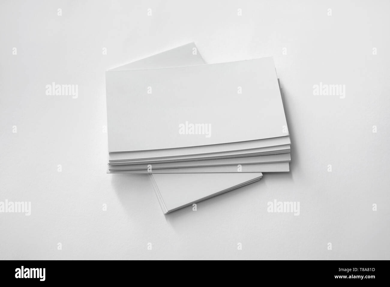 Blank business cards on white background Stock Photo - Alamy