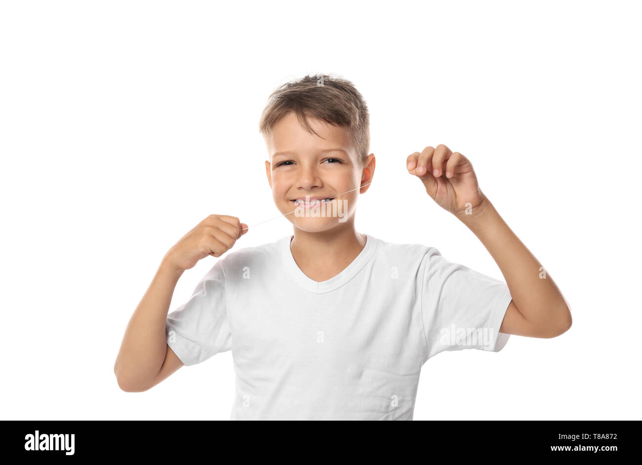 Cute little boy flossing teeth on white background Stock Photo - Alamy