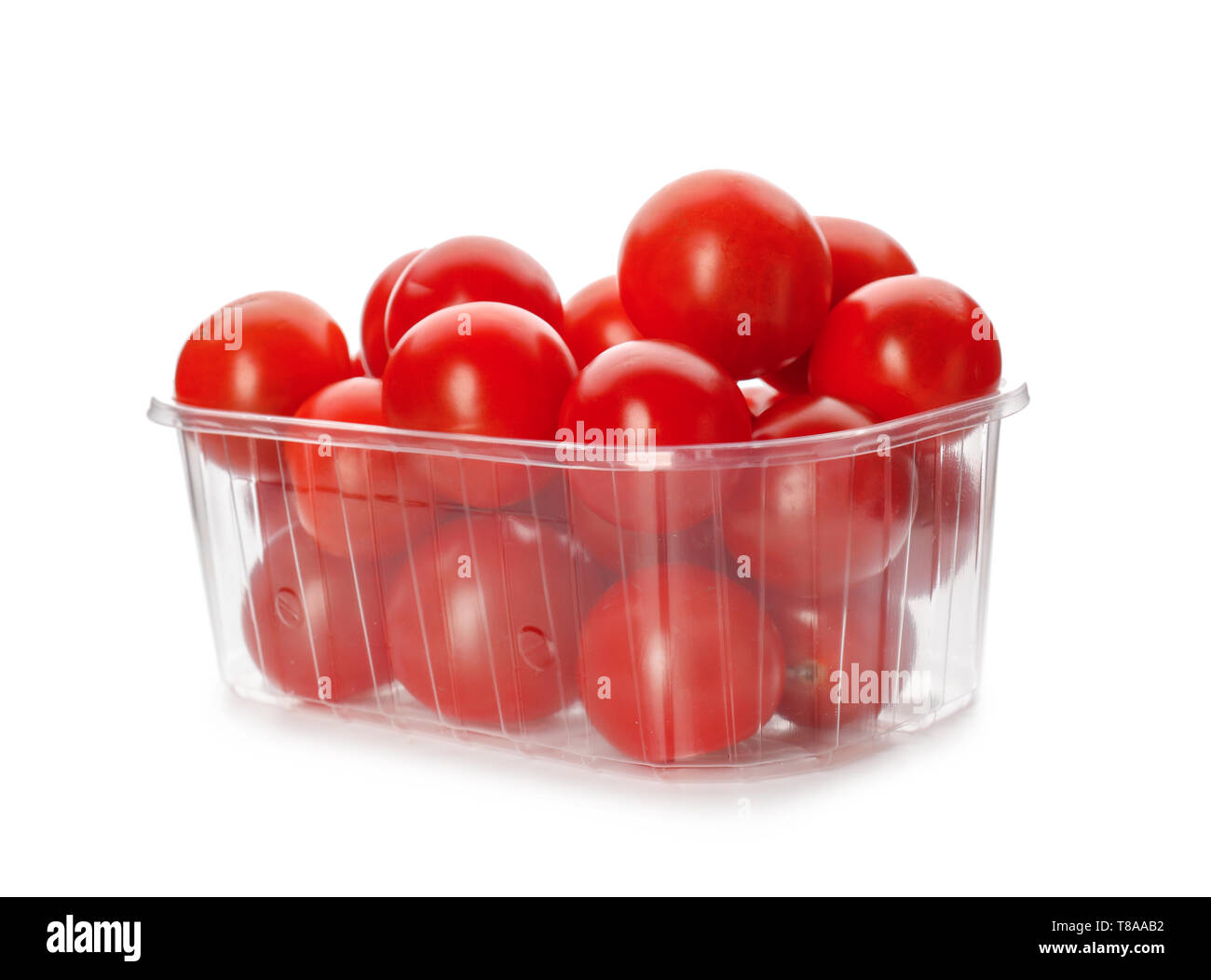 Plastic container with ripe cherry tomatoes on white background Stock ...