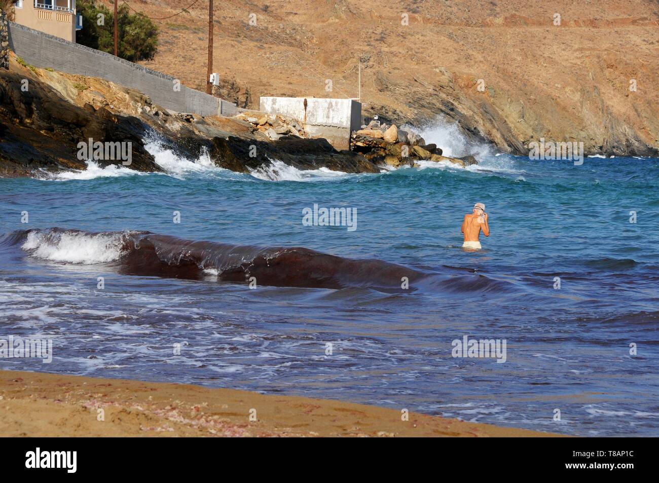Waves breaking on a jetty in Crete Stock Photo - Alamy