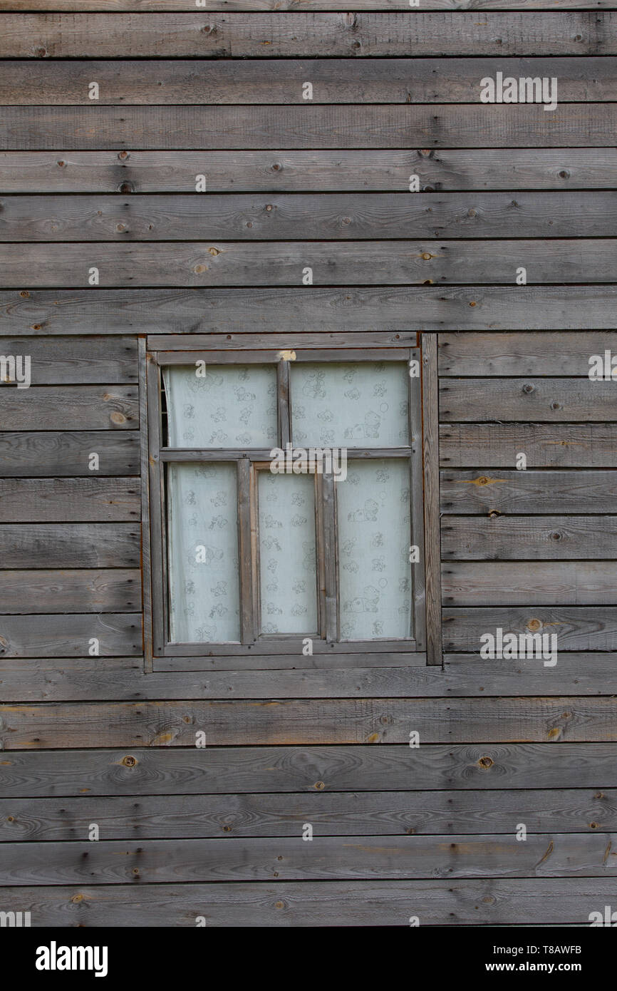 Fragment of one of walls of old village building with window Stock ...