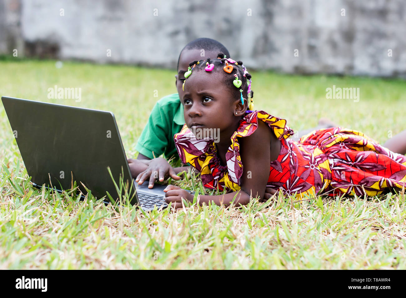 children using computer in the garden Stock Photo - Alamy