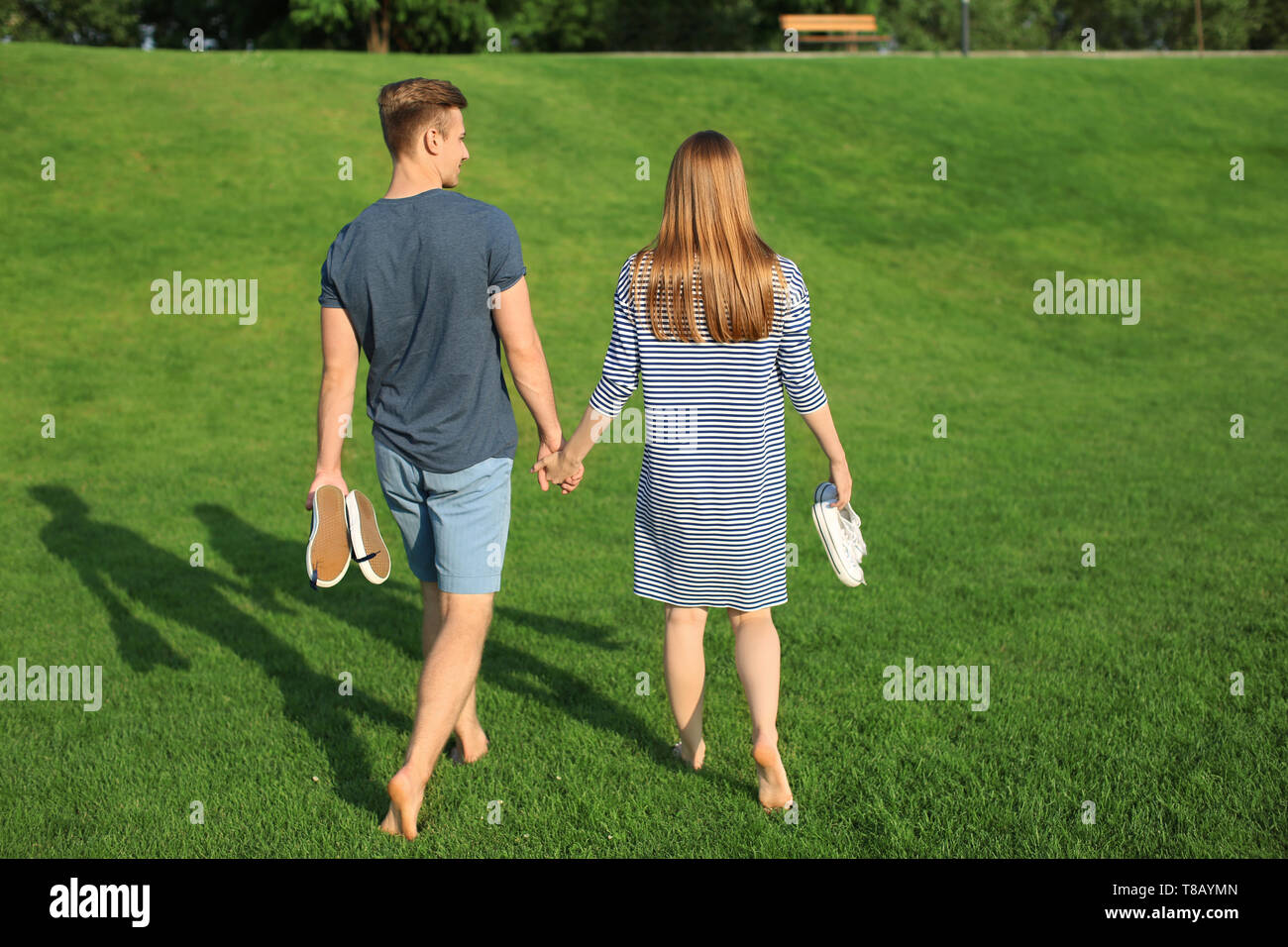 Female walking barefoot in grass hi-res stock photography and images ...