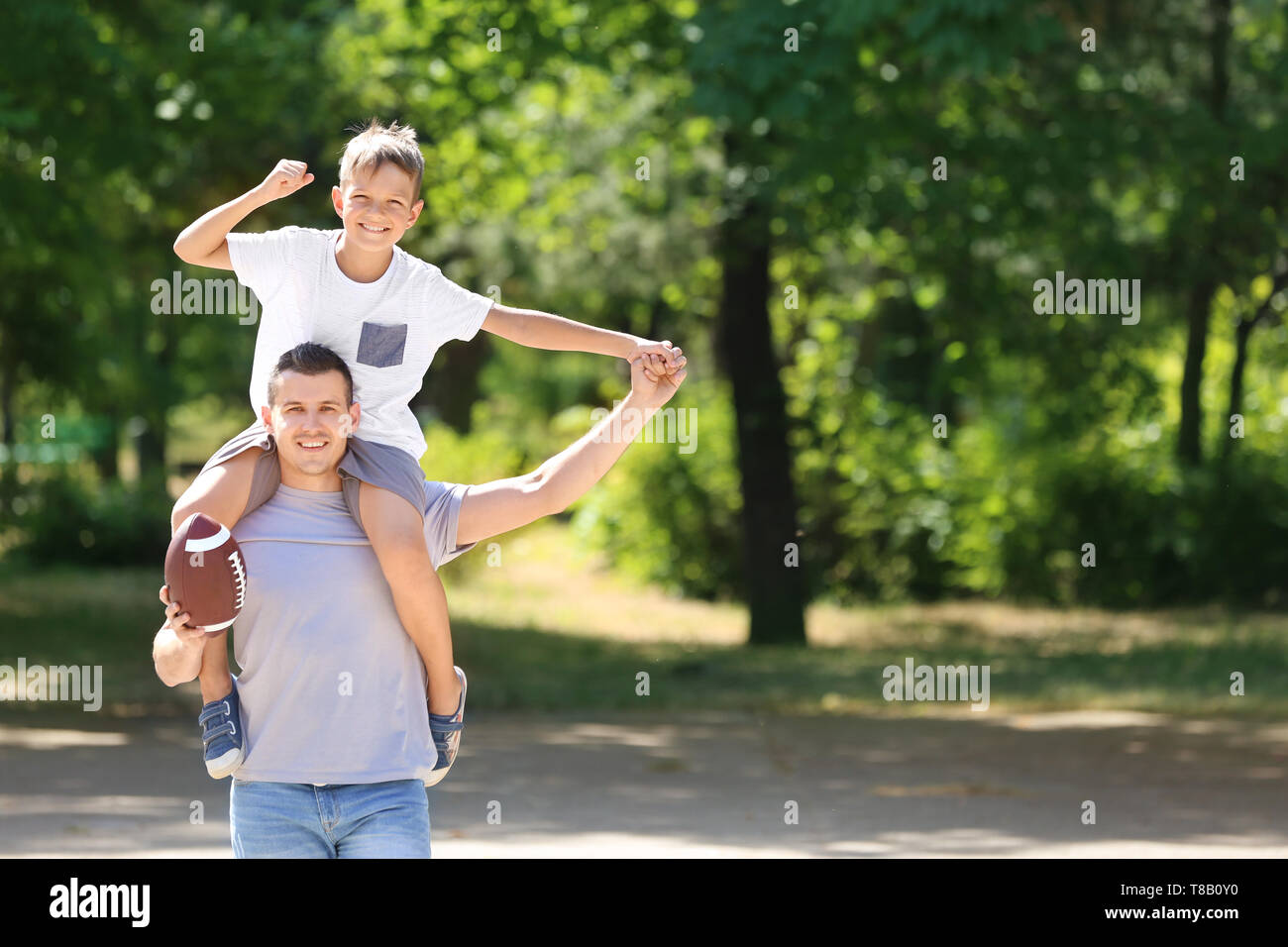 Dad and son playing rugby hi-res stock photography and images - Alamy