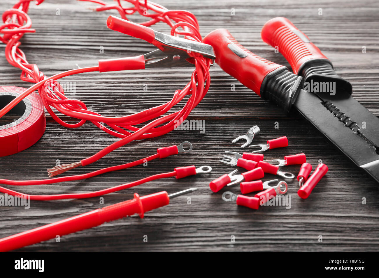 Different electrician's tools and supplies on wooden background Stock ...