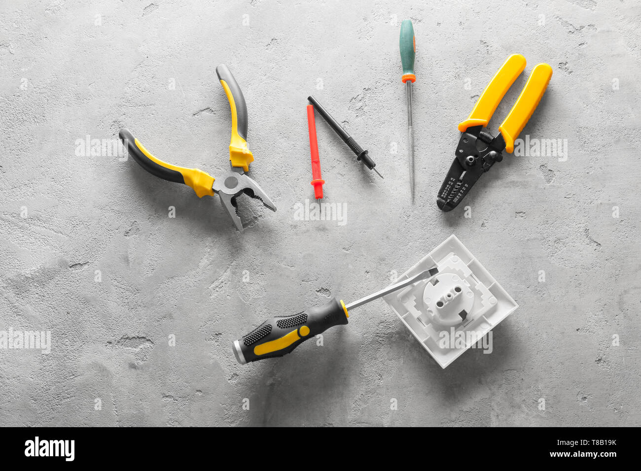 Different electrician's tools with socket on light background Stock ...