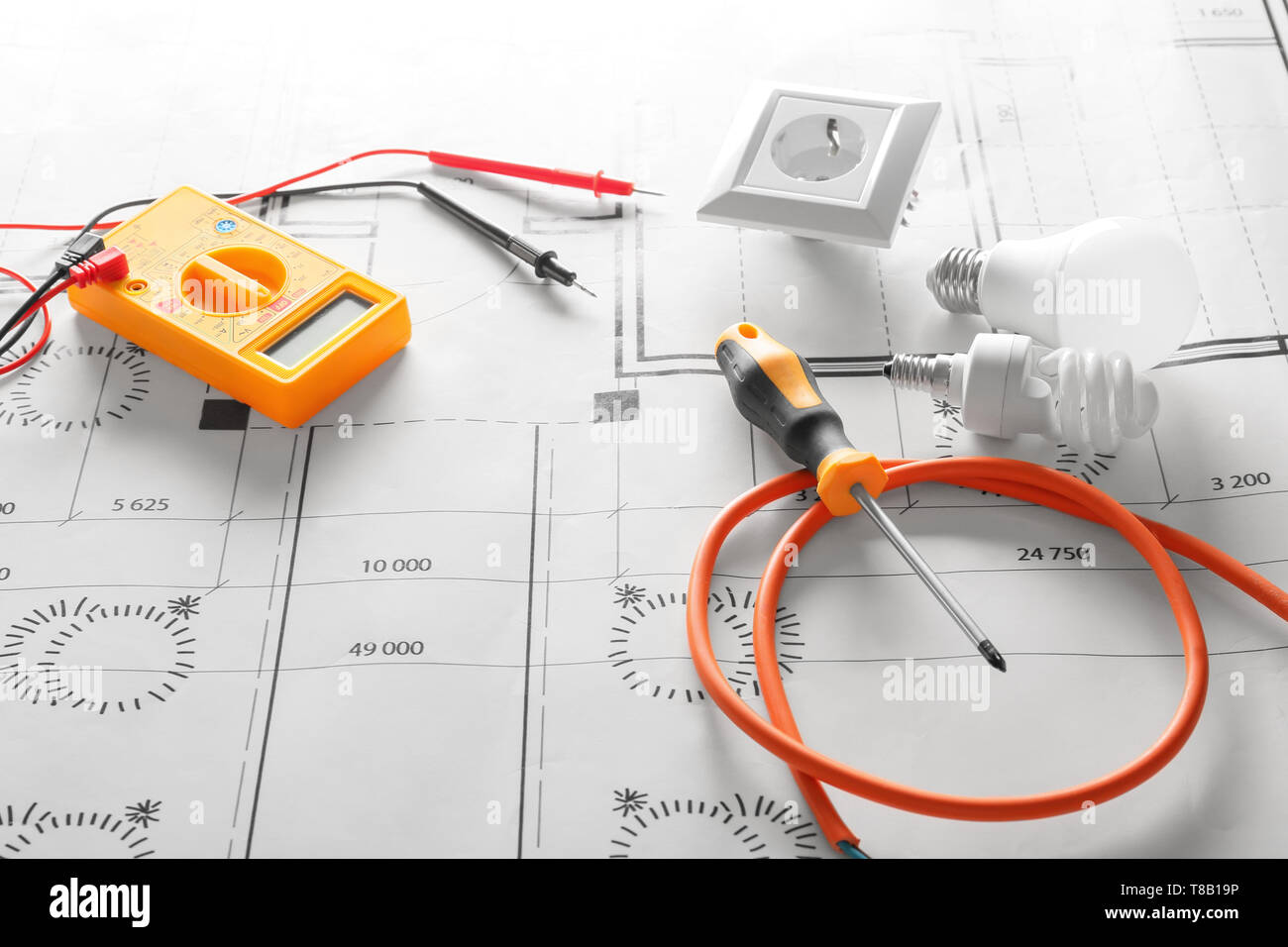 Different electrician's supplies on electrical scheme Stock Photo - Alamy