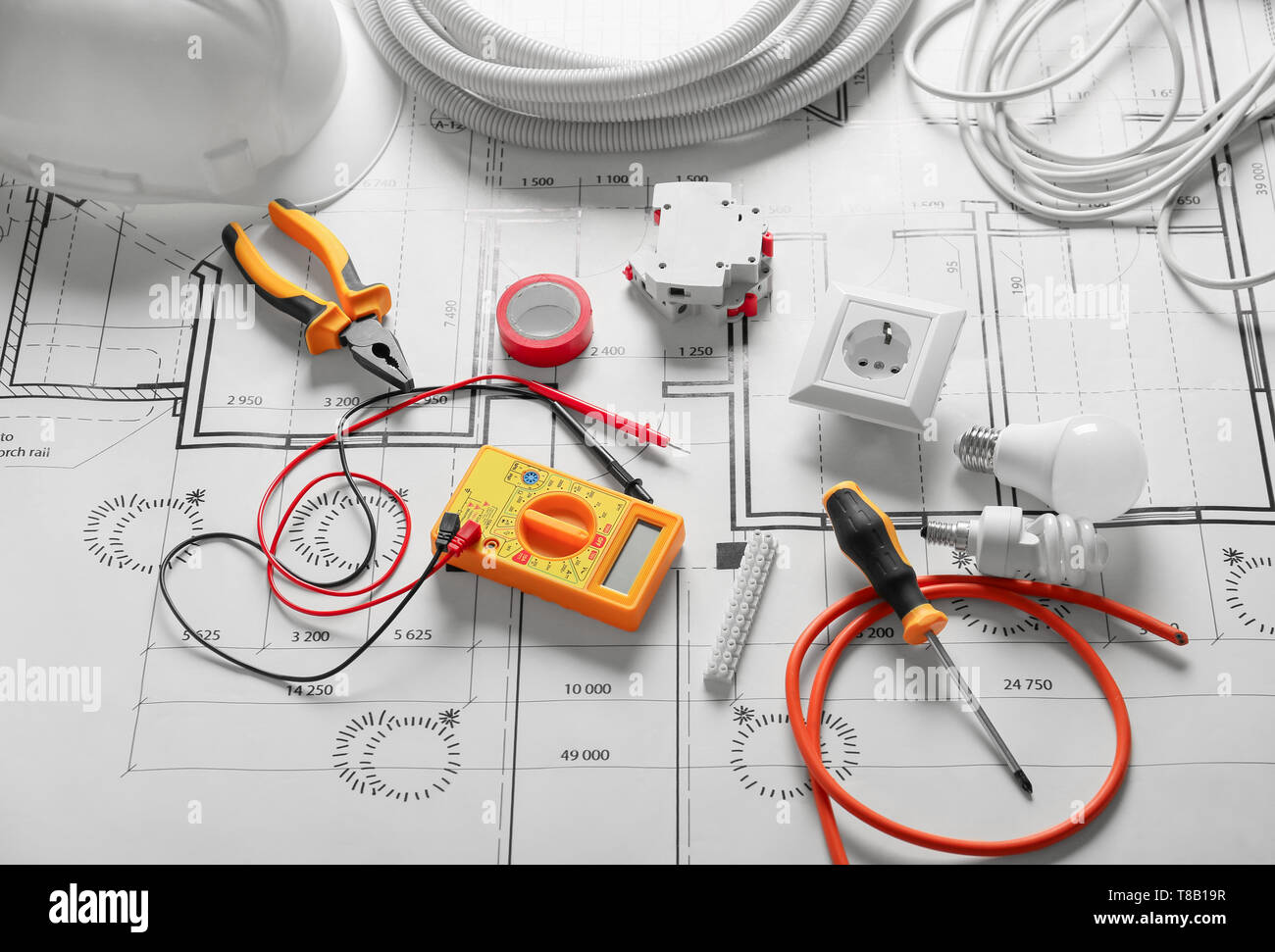 Different electrician's supplies on electrical scheme Stock Photo - Alamy