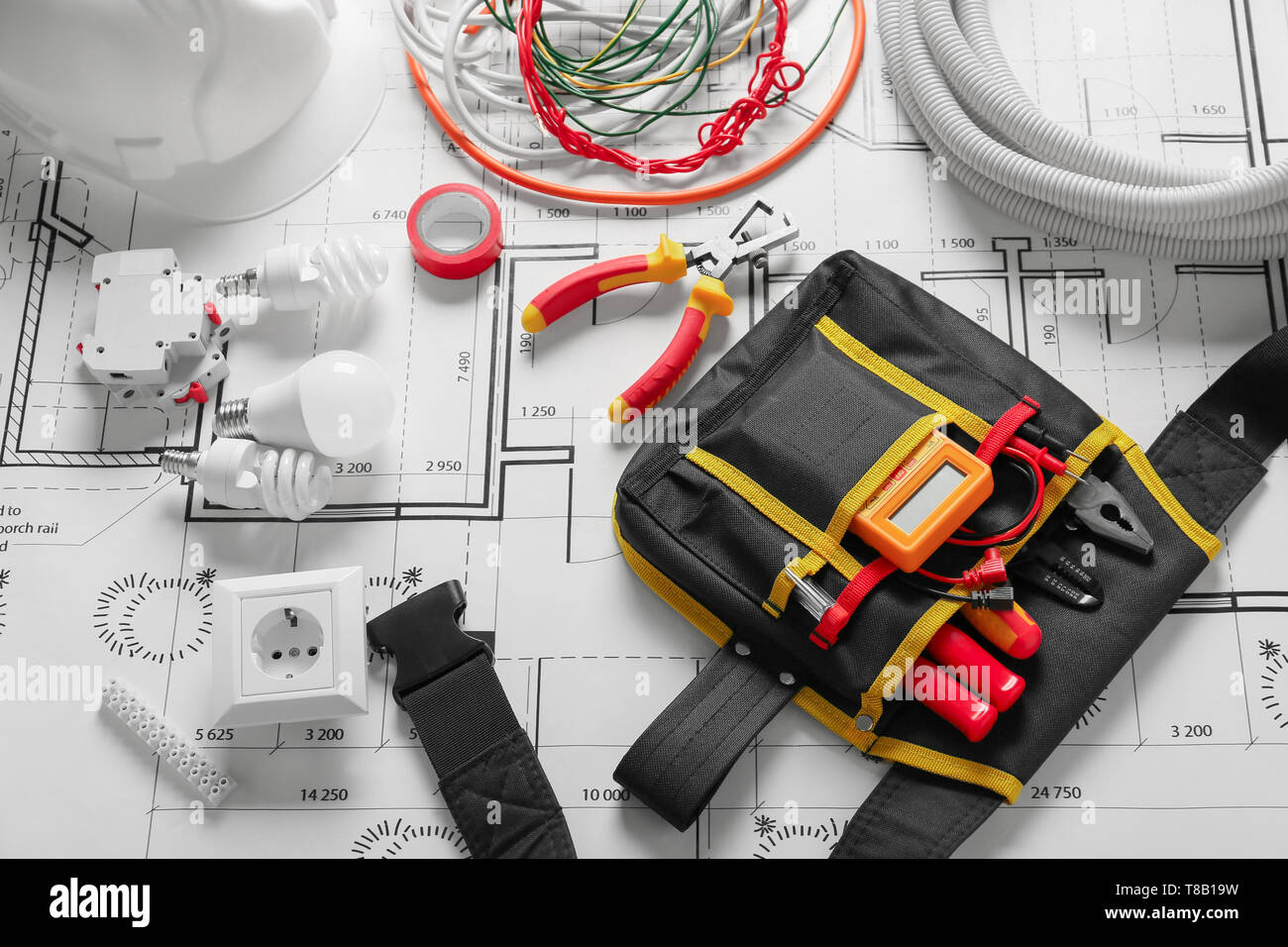 Different electrician's supplies on electrical scheme Stock Photo - Alamy