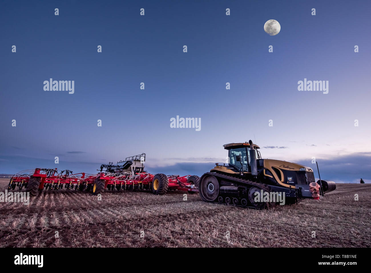 Swift Current, SK/Canada- 10 May, 2019: Full moon over Caterpillar ...